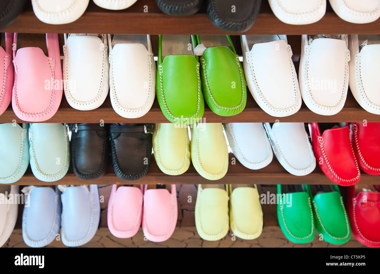 variety of the colorful leather shoes in the shop Stock Photo - Alamy