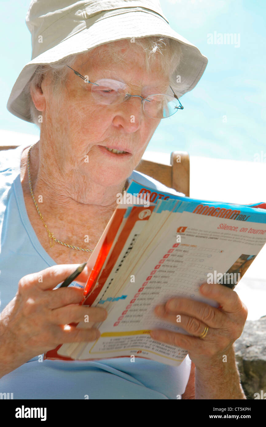 ELDERLY PERSON READING Stock Photo - Alamy