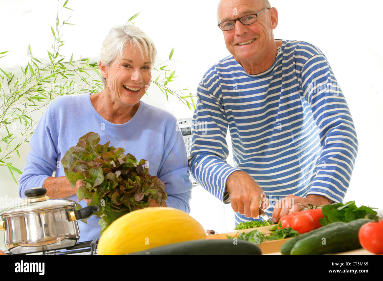 ELDERLY PERSON IN KITCHEN Stock Photo - Alamy
