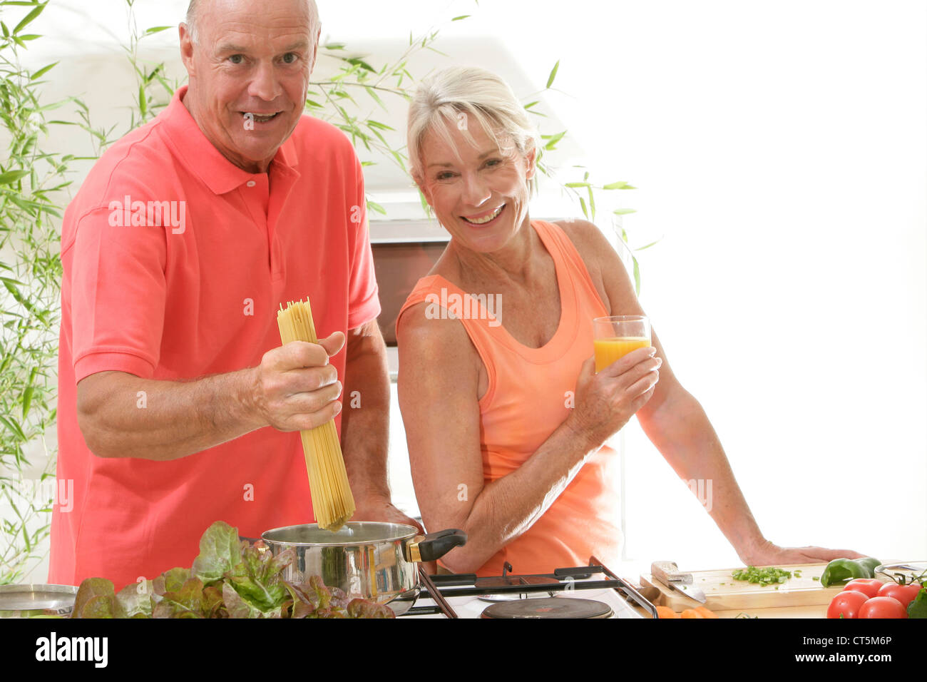ELDERLY PERSON IN KITCHEN Stock Photo - Alamy