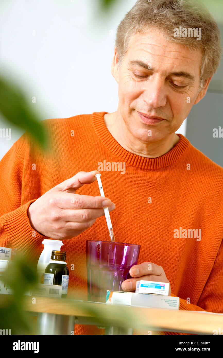 ELDERLY PERSON TAKING MEDICATION Stock Photo - Alamy