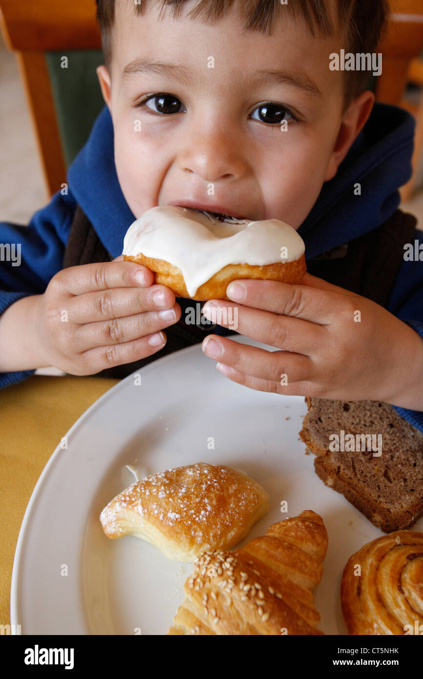 Child snack greedy hi-res stock photography and images - Alamy
