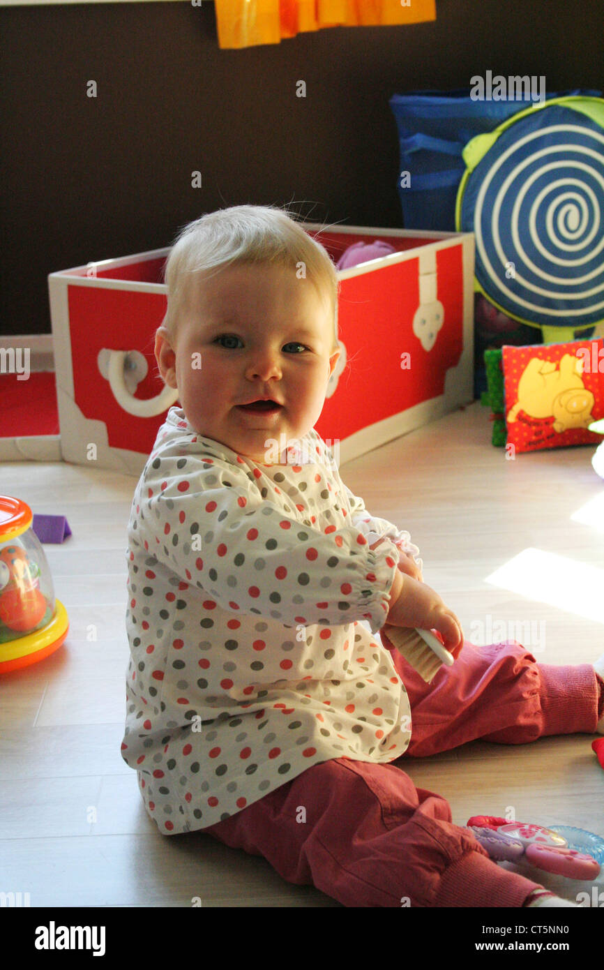 INFANT PLAYING INDOORS Stock Photo - Alamy