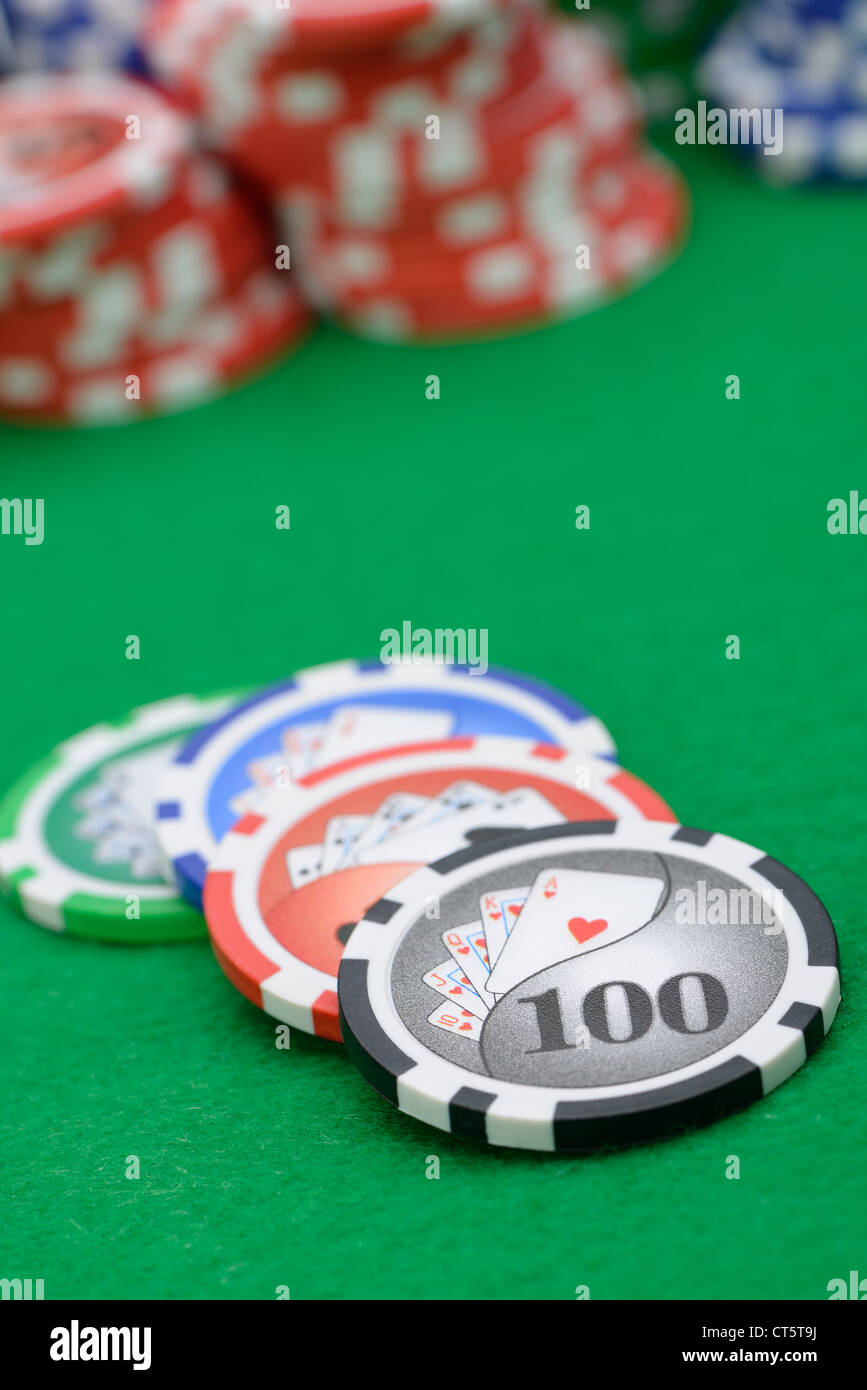 Gaming chips on the green cloth. High detailed photo Stock Photo - Alamy