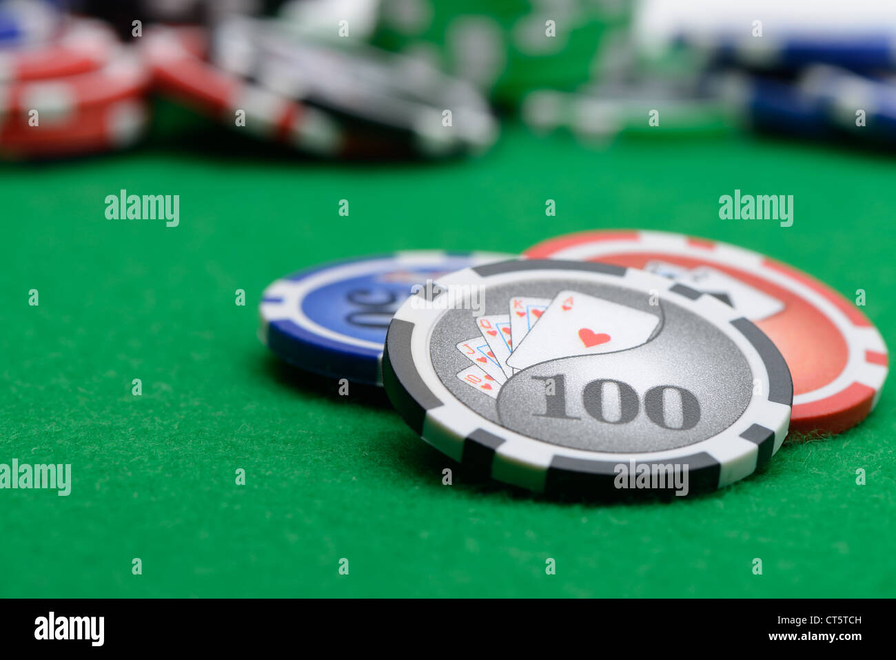 Gaming chips on the green cloth. High detailed photo Stock Photo - Alamy