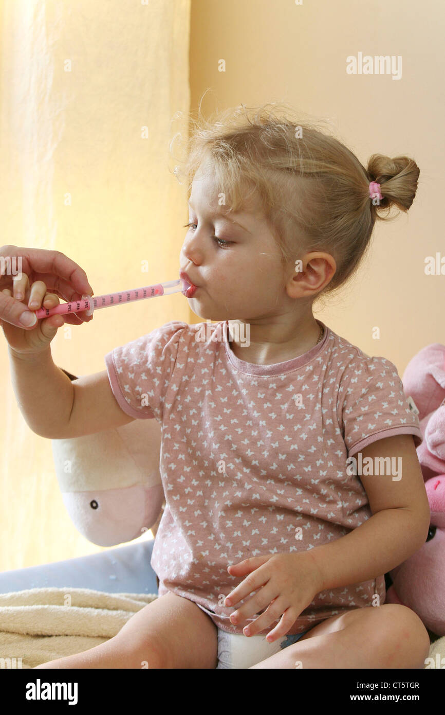 CHILD TAKING MEDICATION Stock Photo - Alamy