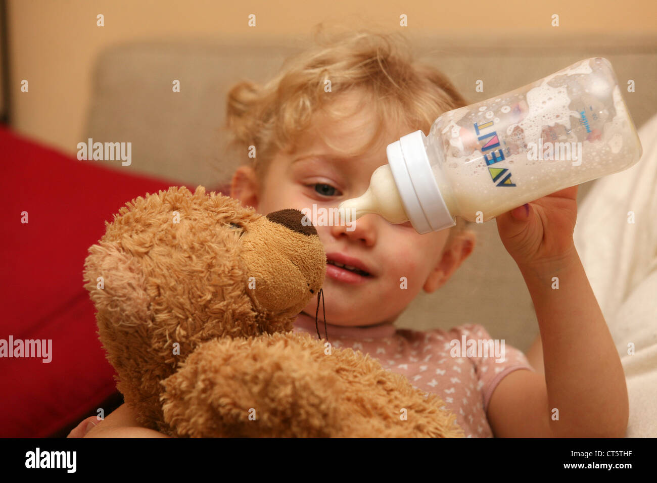 CHILD WITH BABY BOTTLE Stock Photo - Alamy