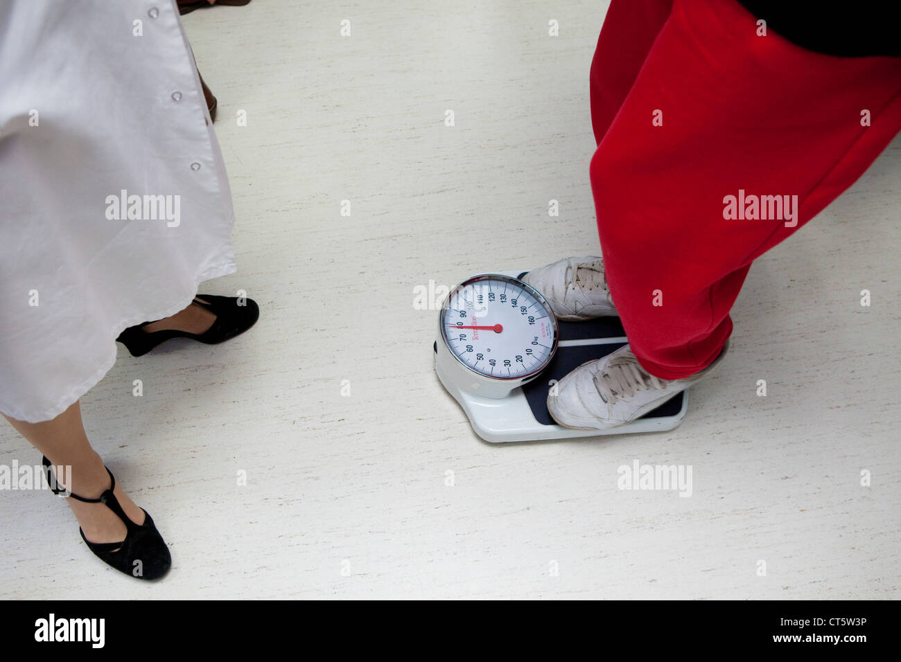 ELDERLY PERSON BEING WEIGHED Stock Photo - Alamy
