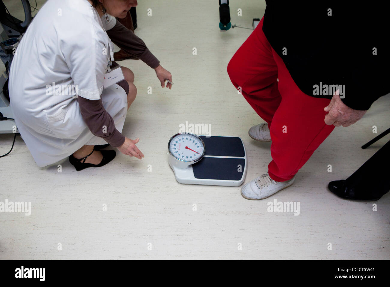 ELDERLY PERSON BEING WEIGHED Stock Photo - Alamy