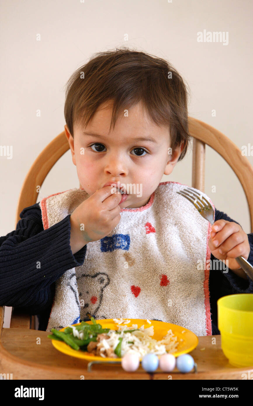 CHILD EATING A MEAL Stock Photo - Alamy