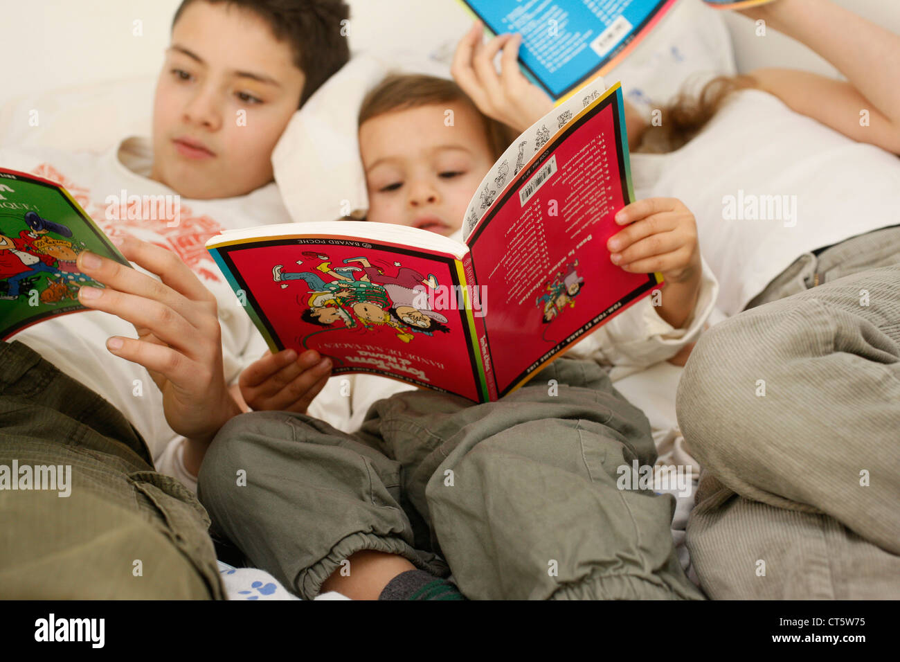 CHILD READING INDOORS Stock Photo - Alamy
