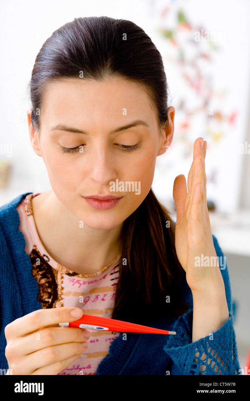 WOMAN WITH FEVER Stock Photo - Alamy