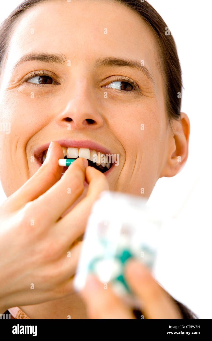 WOMAN TAKING MEDICATION Stock Photo - Alamy