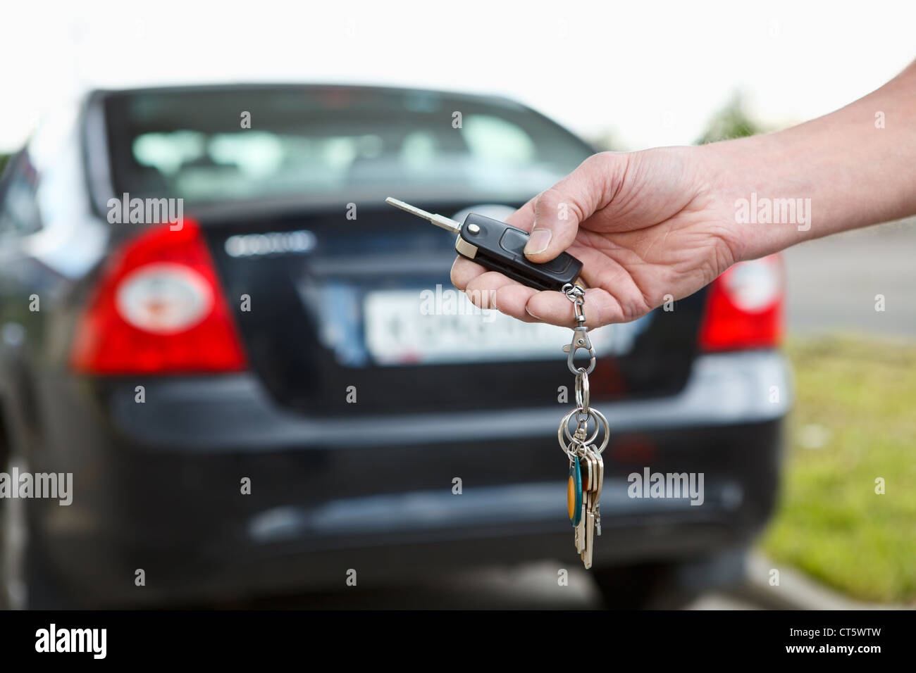 Man hand pressing on the remote control car alarm systems Stock Photo ...