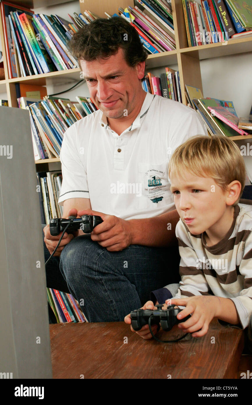 CHILD PLAYING WITH VIDEO GAME Stock Photo - Alamy