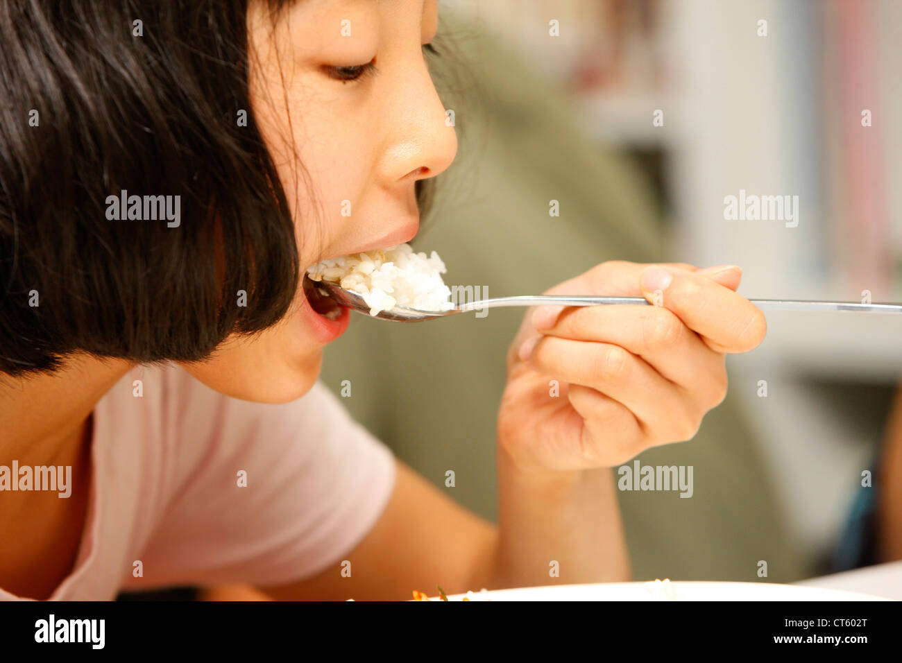 CHILD EATING STARCHY FOOD Stock Photo - Alamy