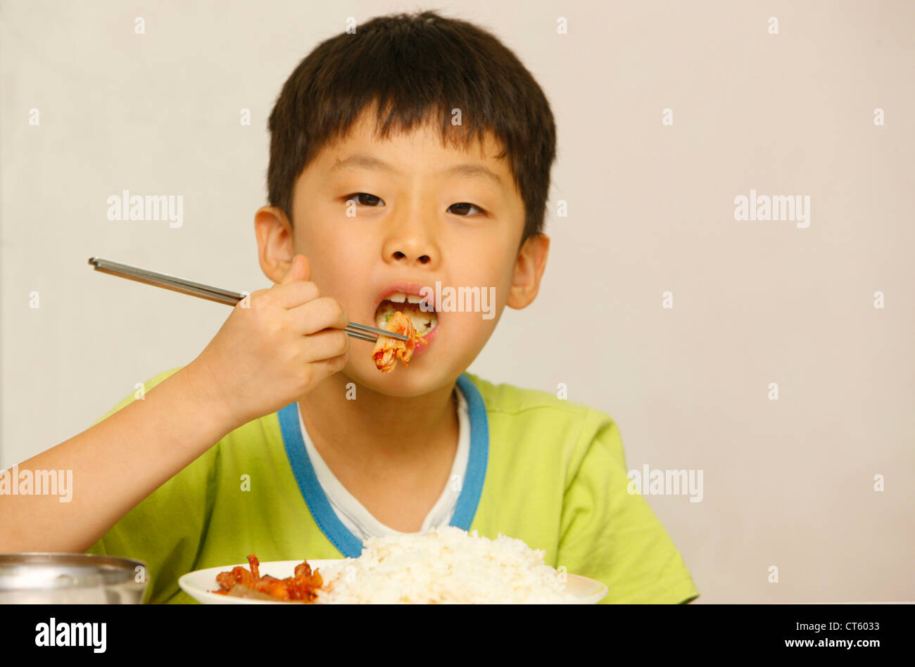 CHILD EATING A MEAL Stock Photo - Alamy