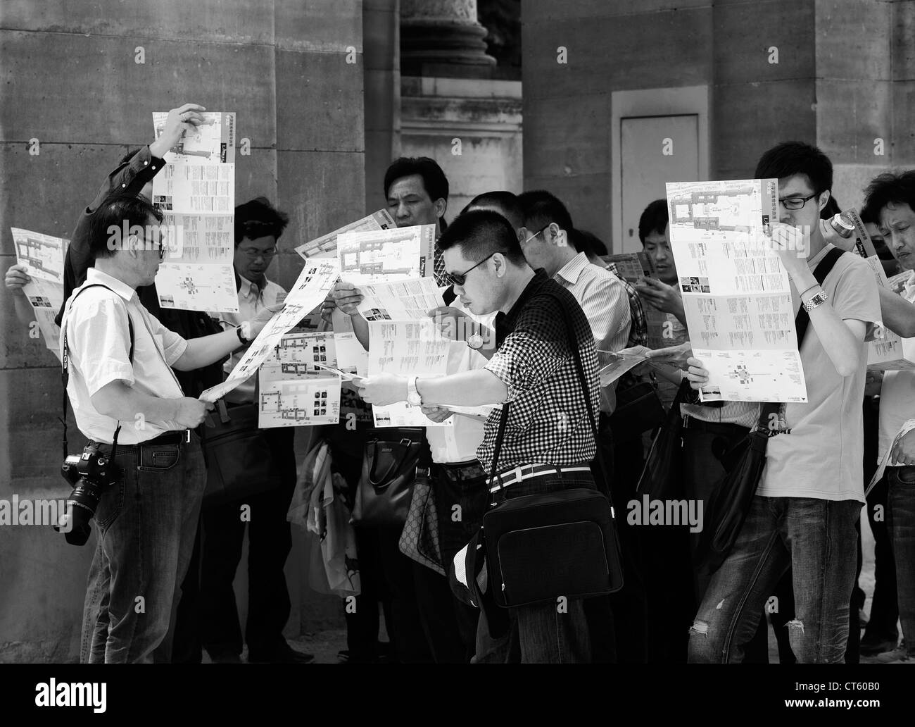 Paris, France - Japanese tourists reading maps (color version available ...
