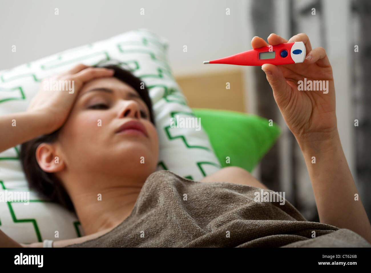 WOMAN WITH FEVER Stock Photo - Alamy