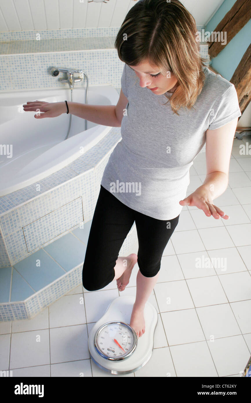 TEENAGER BEING WEIGHED Stock Photo - Alamy
