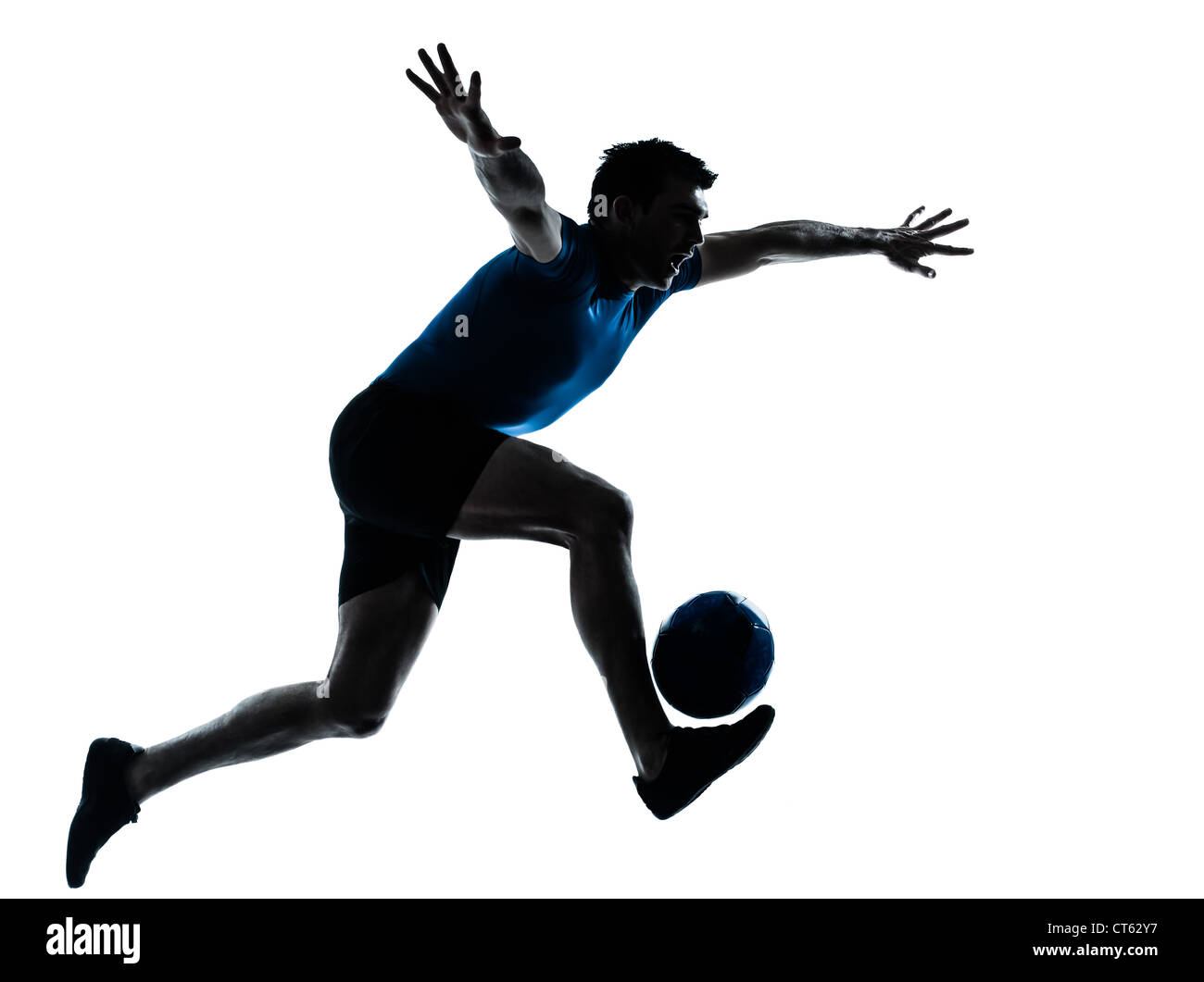 one caucasian man playing soccer football player silhouette in studio ...