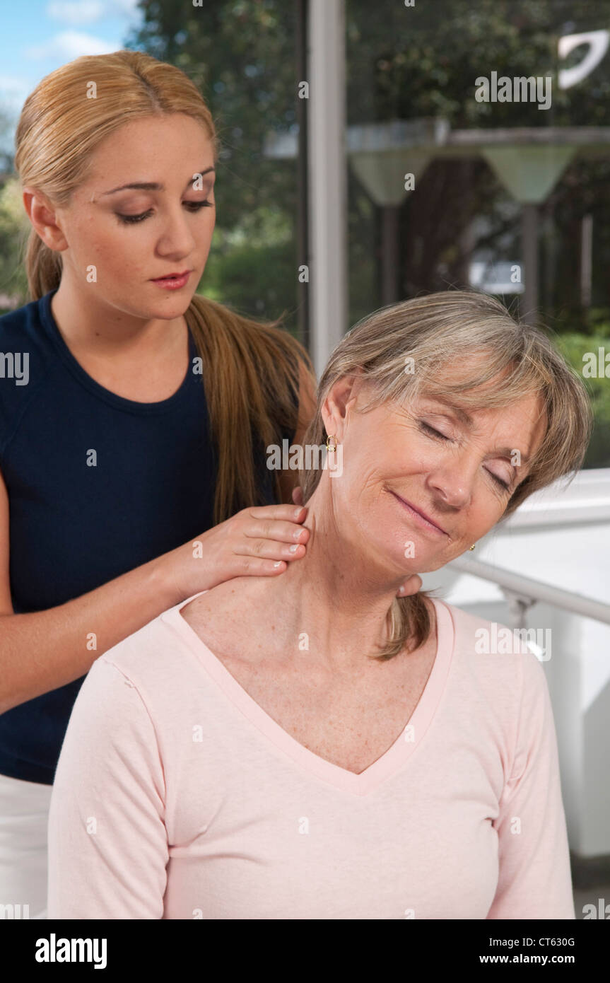 ELDERLY PERSON BEING MASSAGED Stock Photo - Alamy