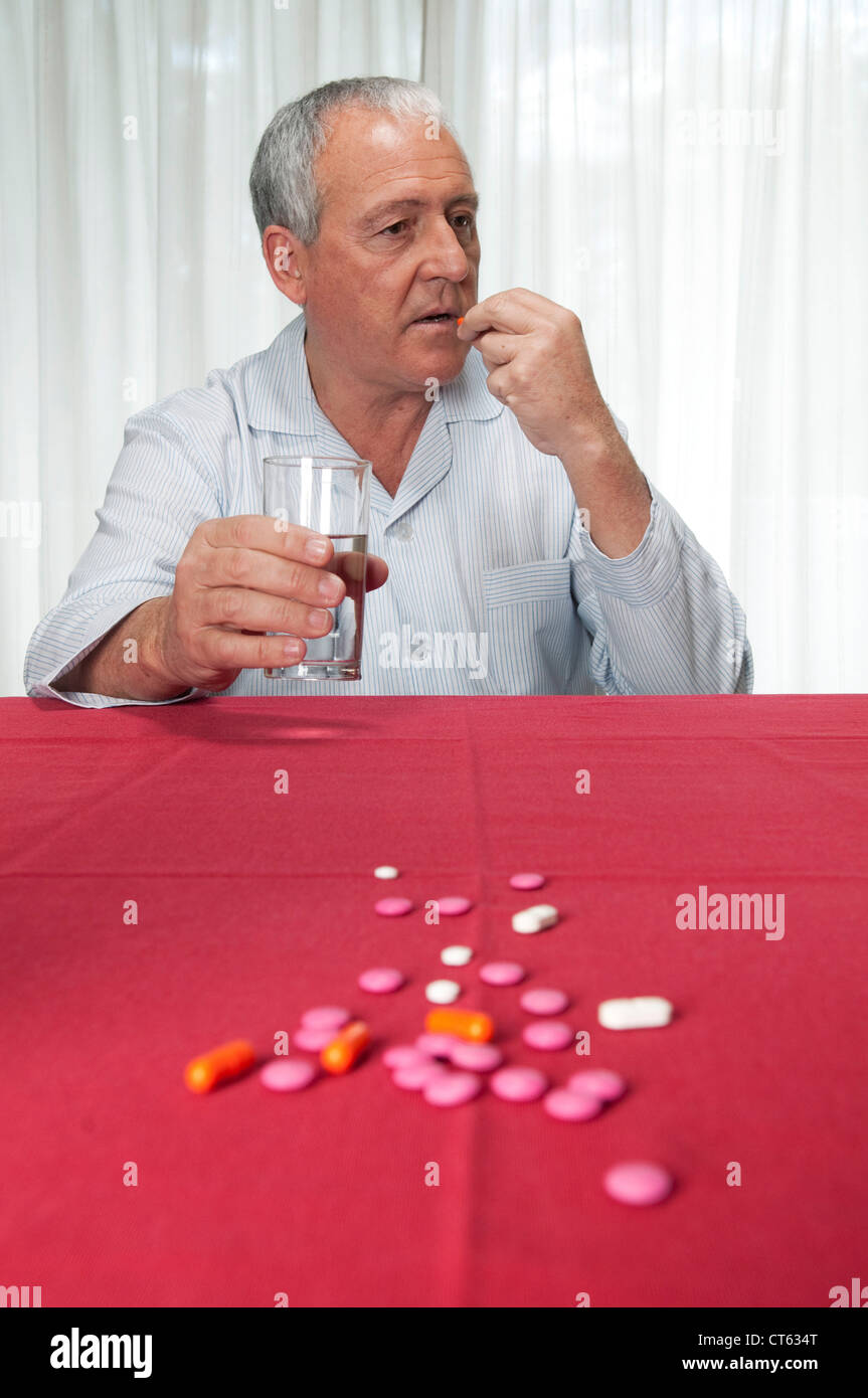 ELDERLY PERSON TAKING MEDICATION Stock Photo - Alamy