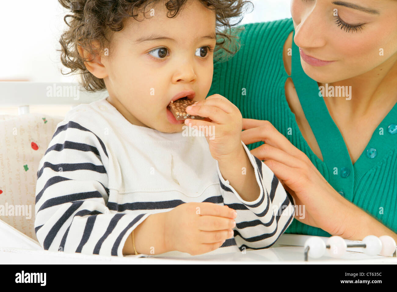 Women with child snacking hi-res stock photography and images - Alamy