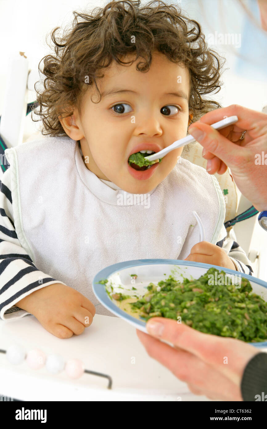 CHILD EATING A MEAL Stock Photo - Alamy