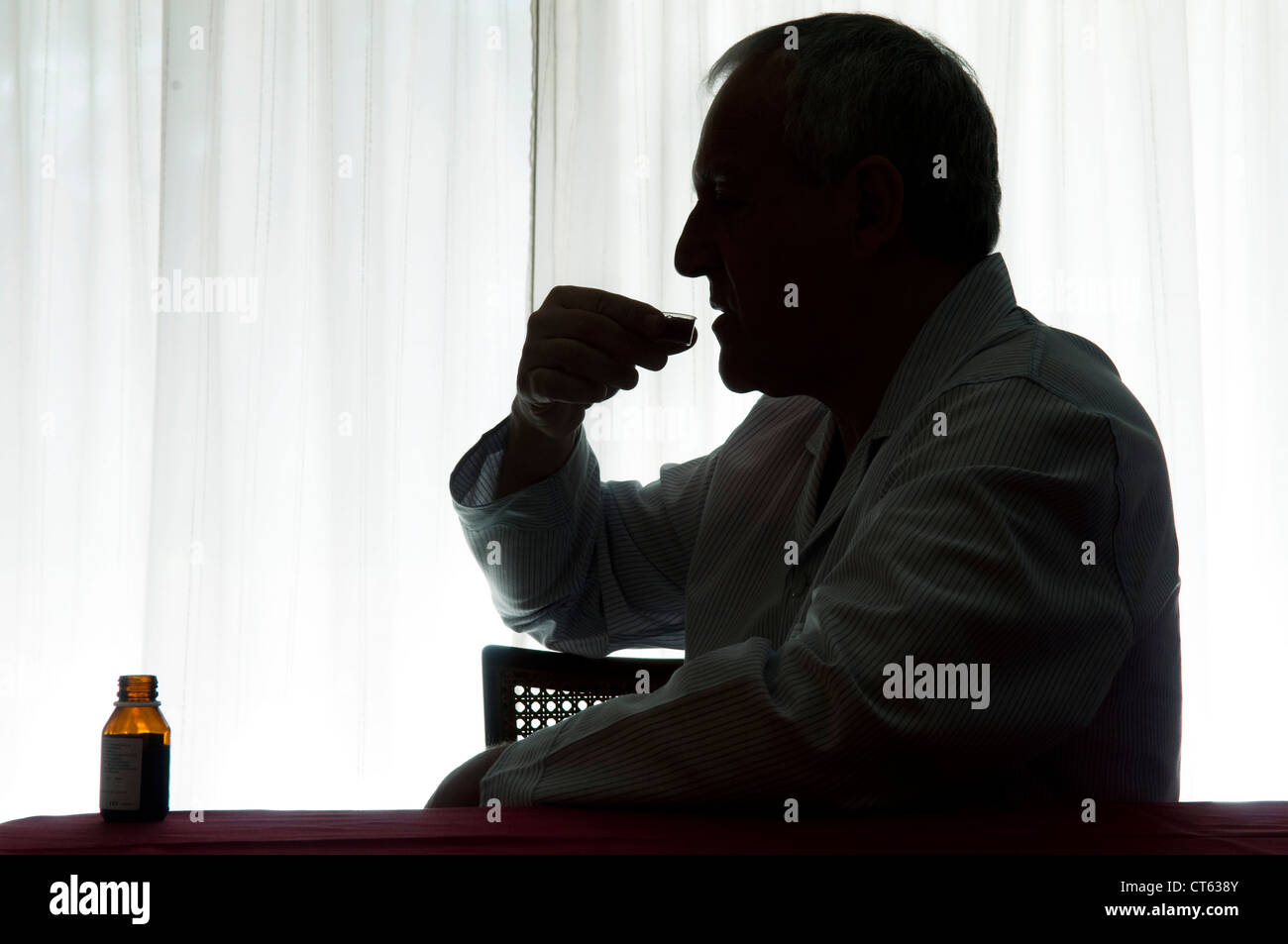 ELDERLY PERSON TAKING MEDICATION Stock Photo - Alamy