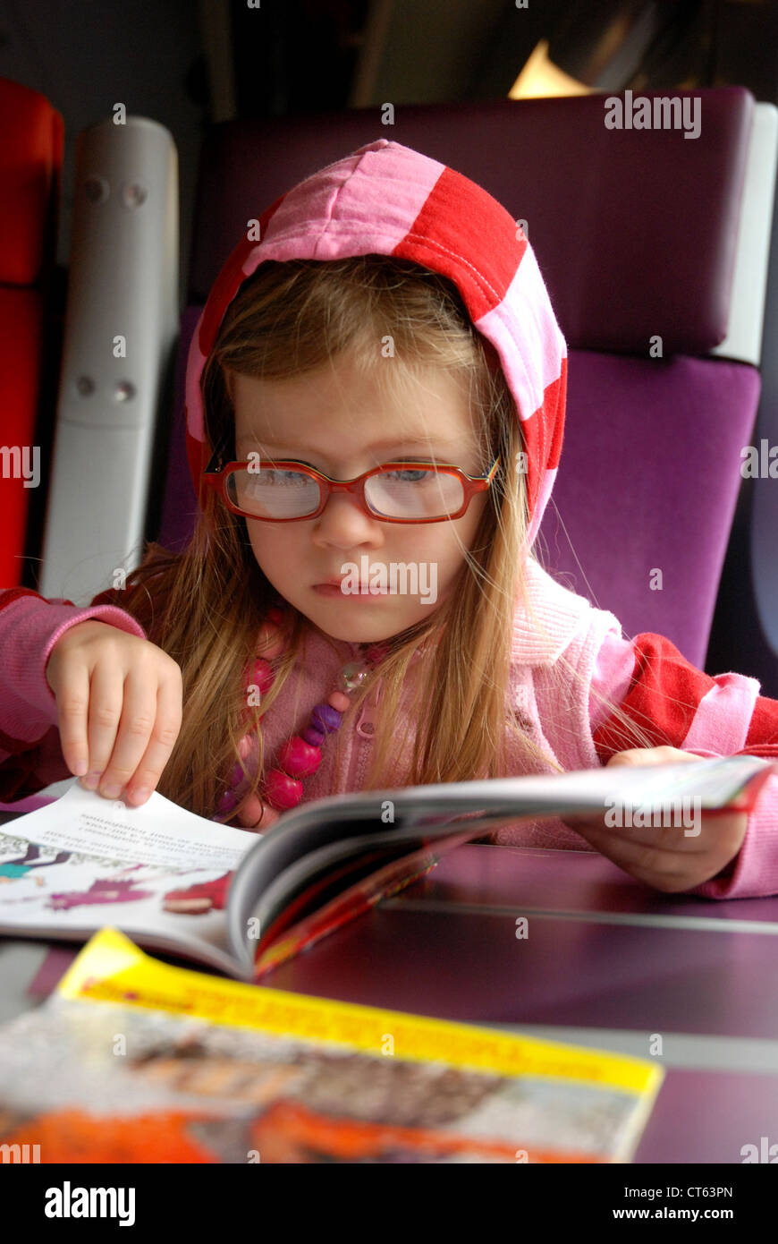 CHILD READING INDOORS Stock Photo - Alamy