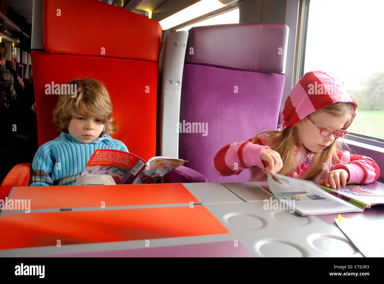 CHILD READING INDOORS Stock Photo - Alamy