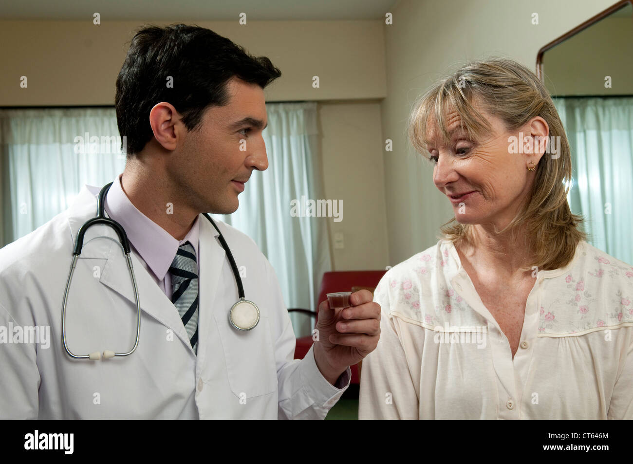 ELDERLY PERSON TAKING MEDICATION Stock Photo - Alamy