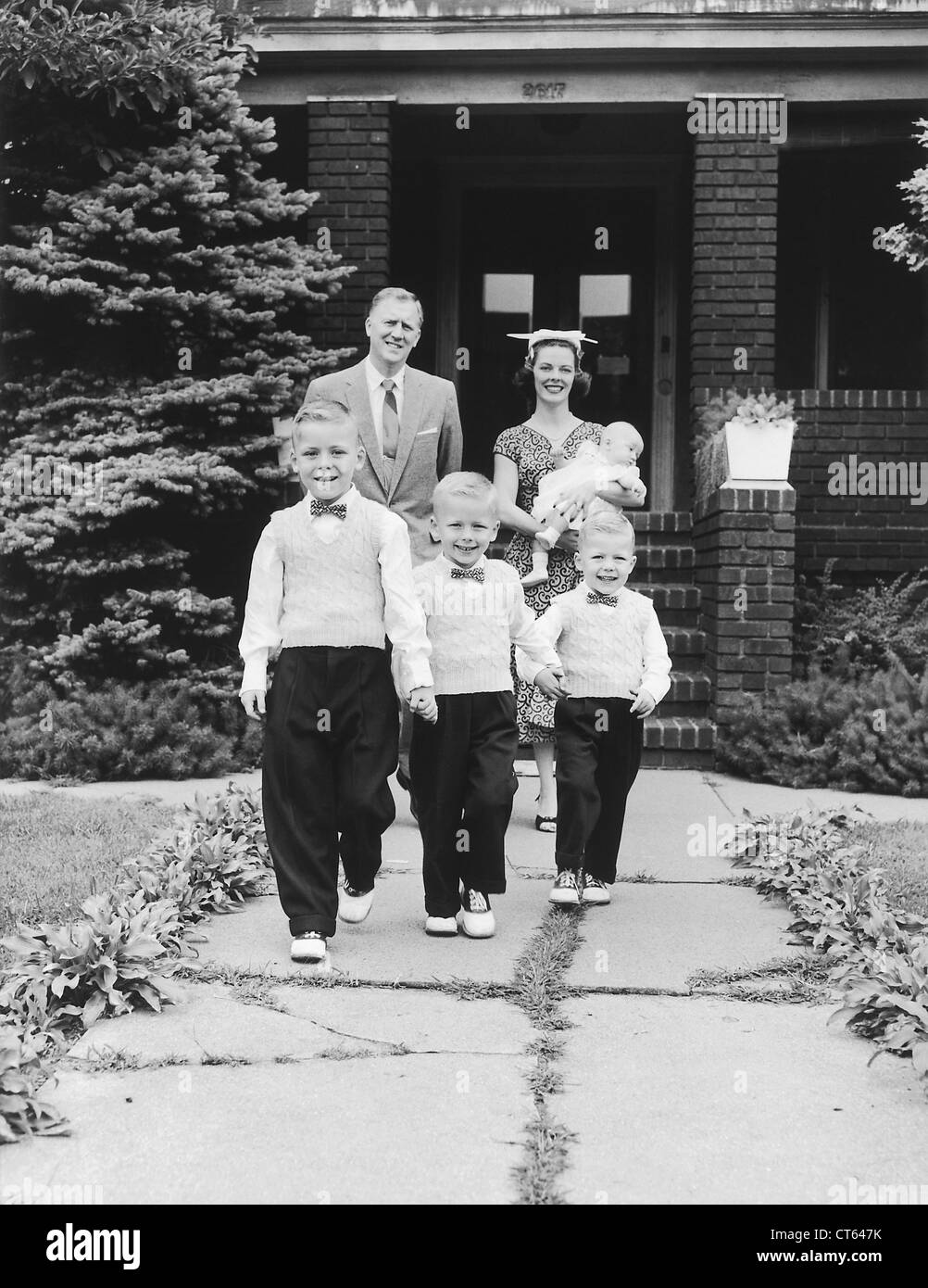 Family portrait in front of house, 1957 Stock Photo - Alamy