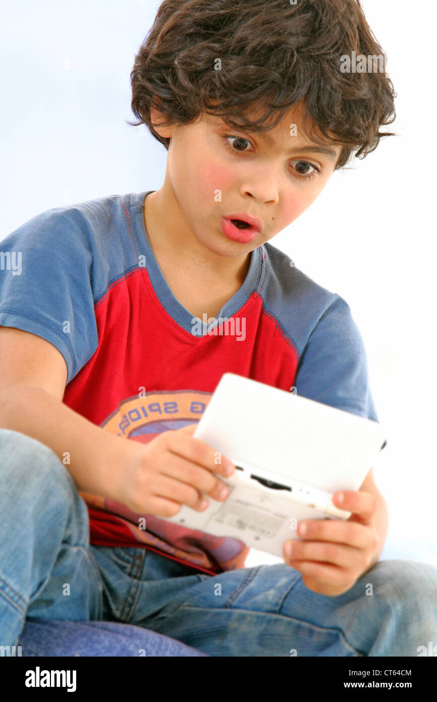 CHILD PLAYING WITH VIDEO GAME Stock Photo - Alamy