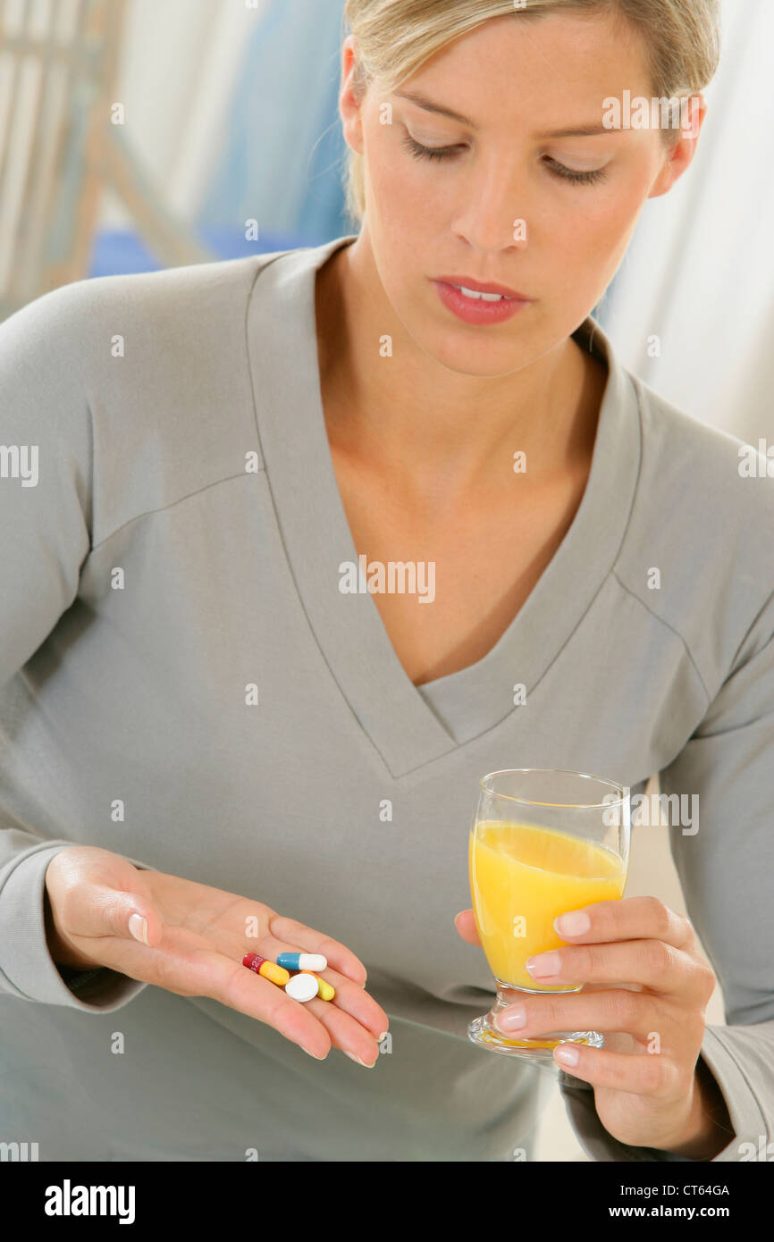 WOMAN TAKING MEDICATION Stock Photo - Alamy
