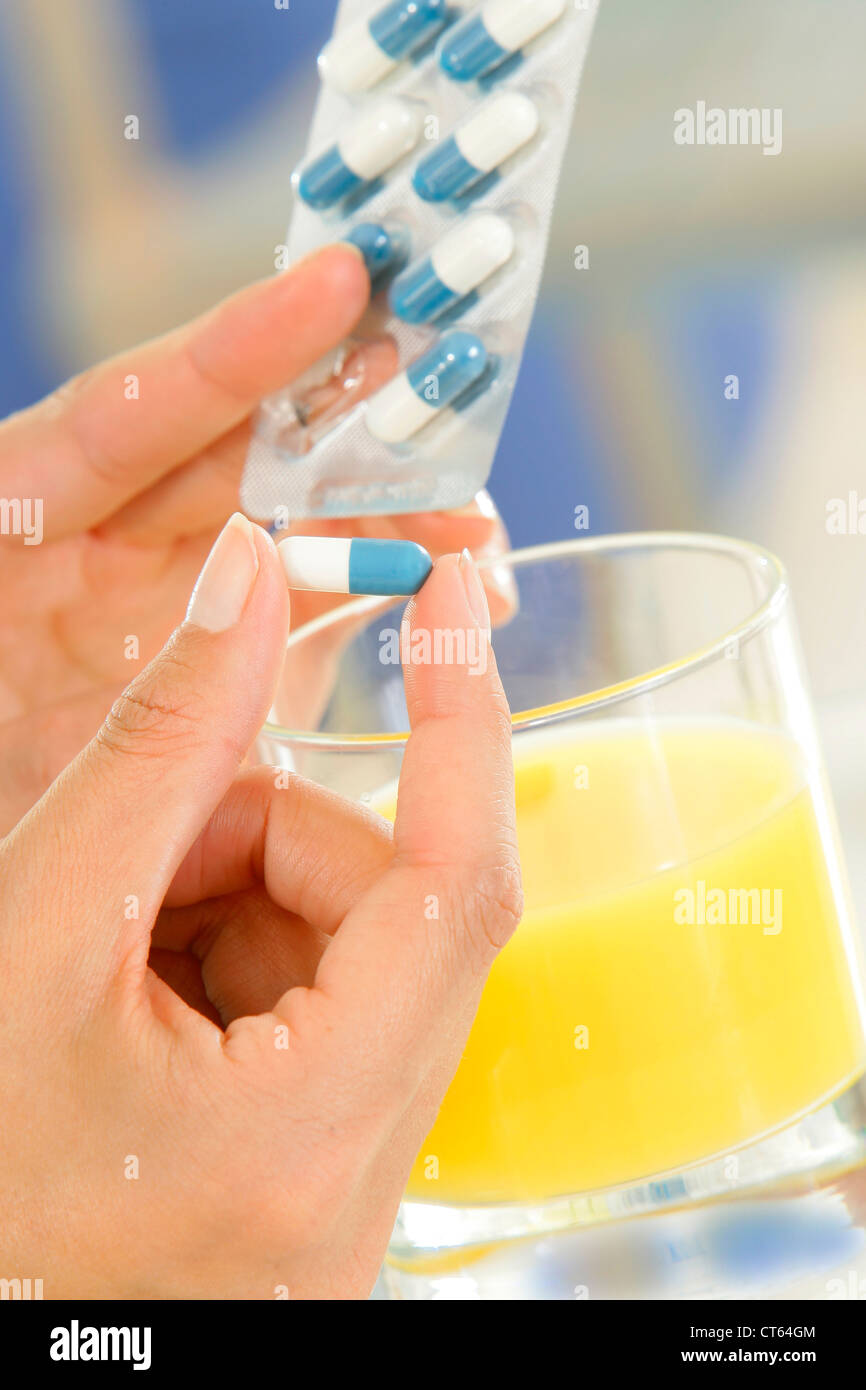 WOMAN TAKING MEDICATION Stock Photo - Alamy
