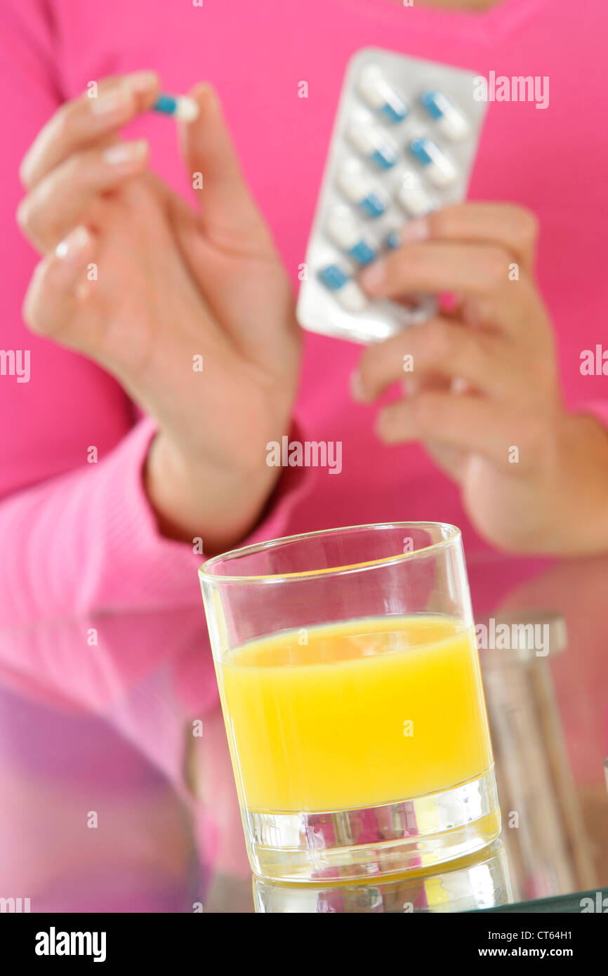 WOMAN TAKING MEDICATION Stock Photo - Alamy