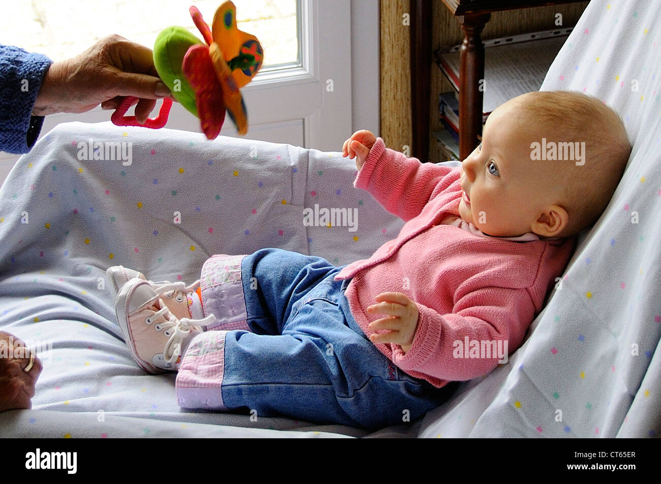 INFANT PLAYING INDOORS Stock Photo - Alamy