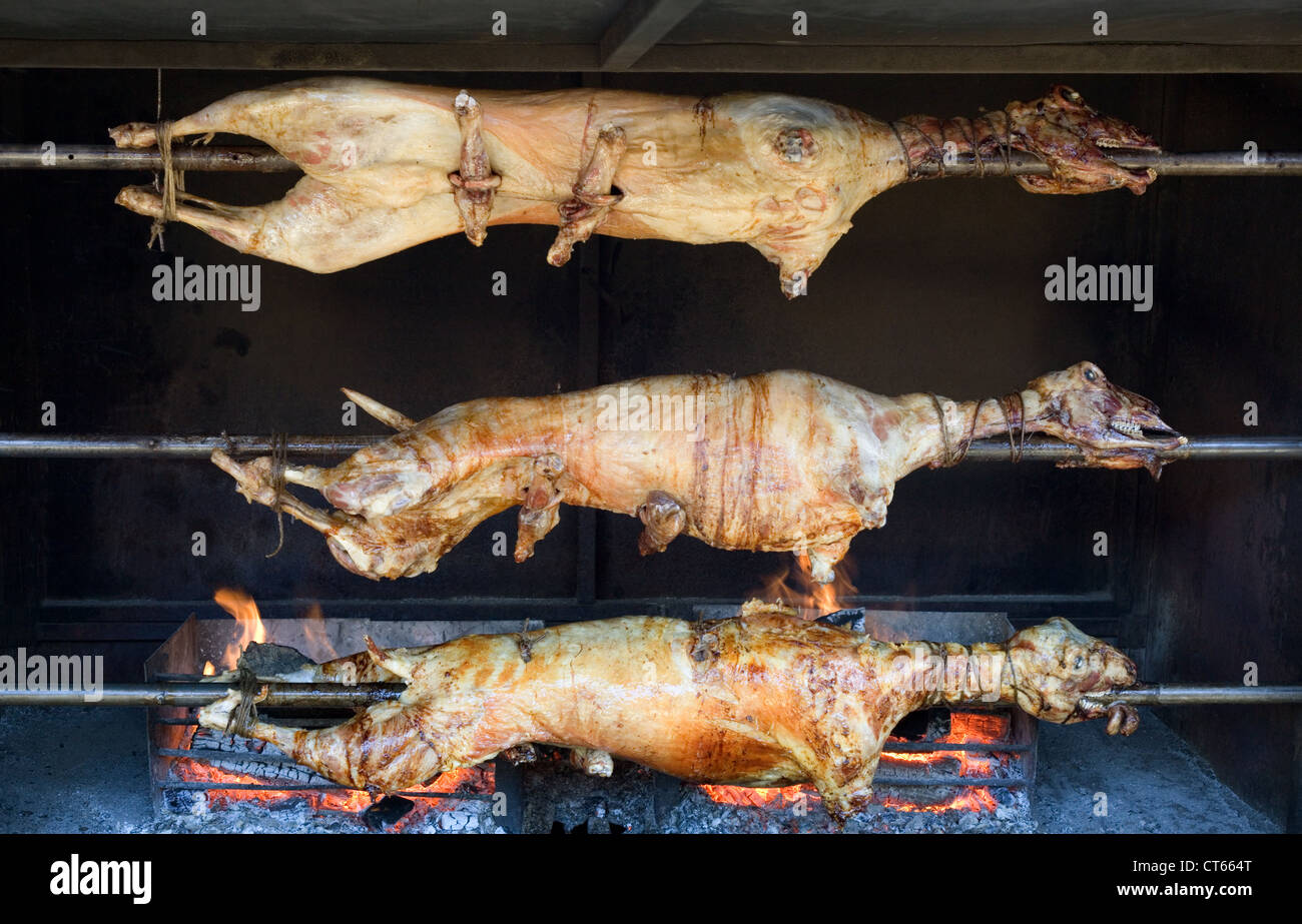 Three Spit Roasted Lamb Barbecue Stock Photo - Alamy