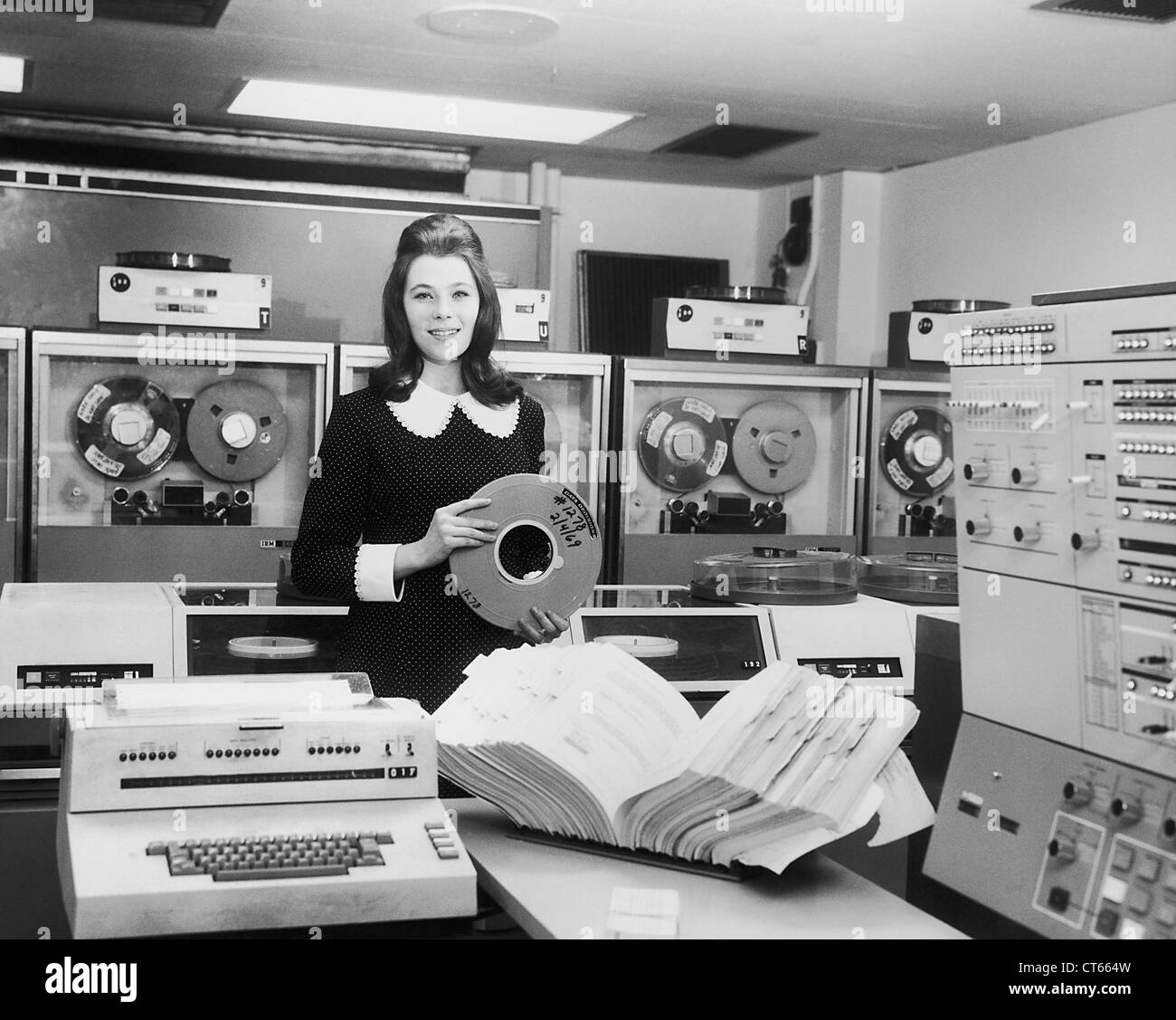 Businesswoman in server room Stock Photo - Alamy