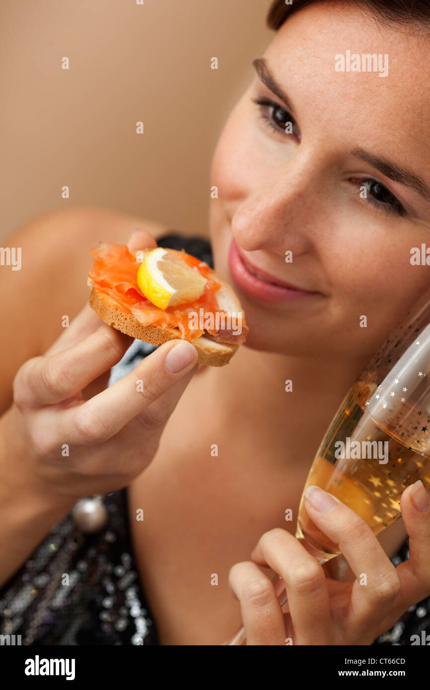 WOMAN EATING FISH Stock Photo - Alamy