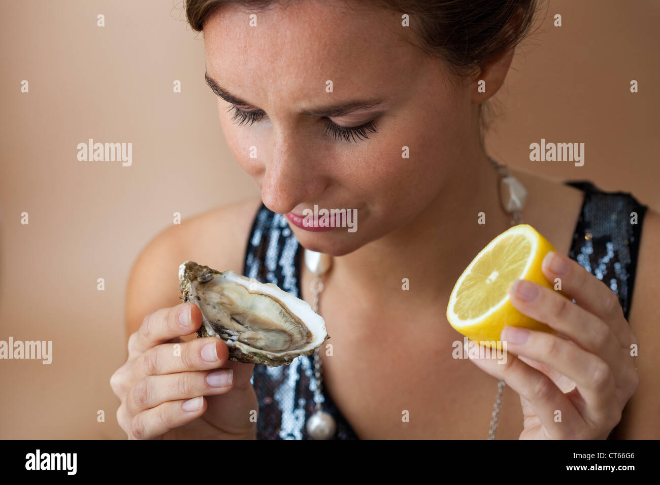 WOMAN EATING SELLFISH Stock Photo - Alamy