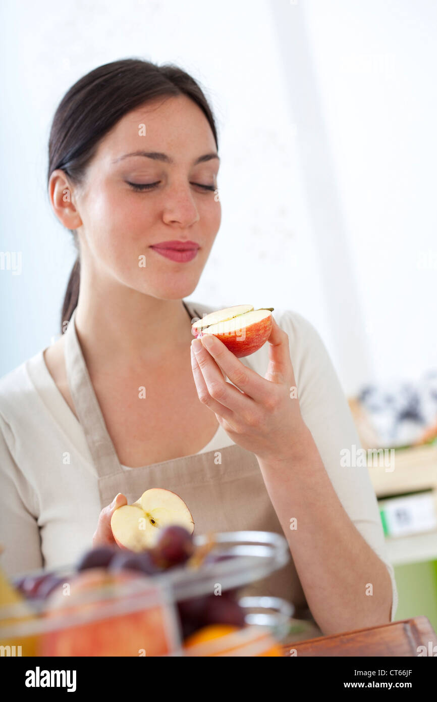 WOMAN EATING FRUIT Stock Photo - Alamy