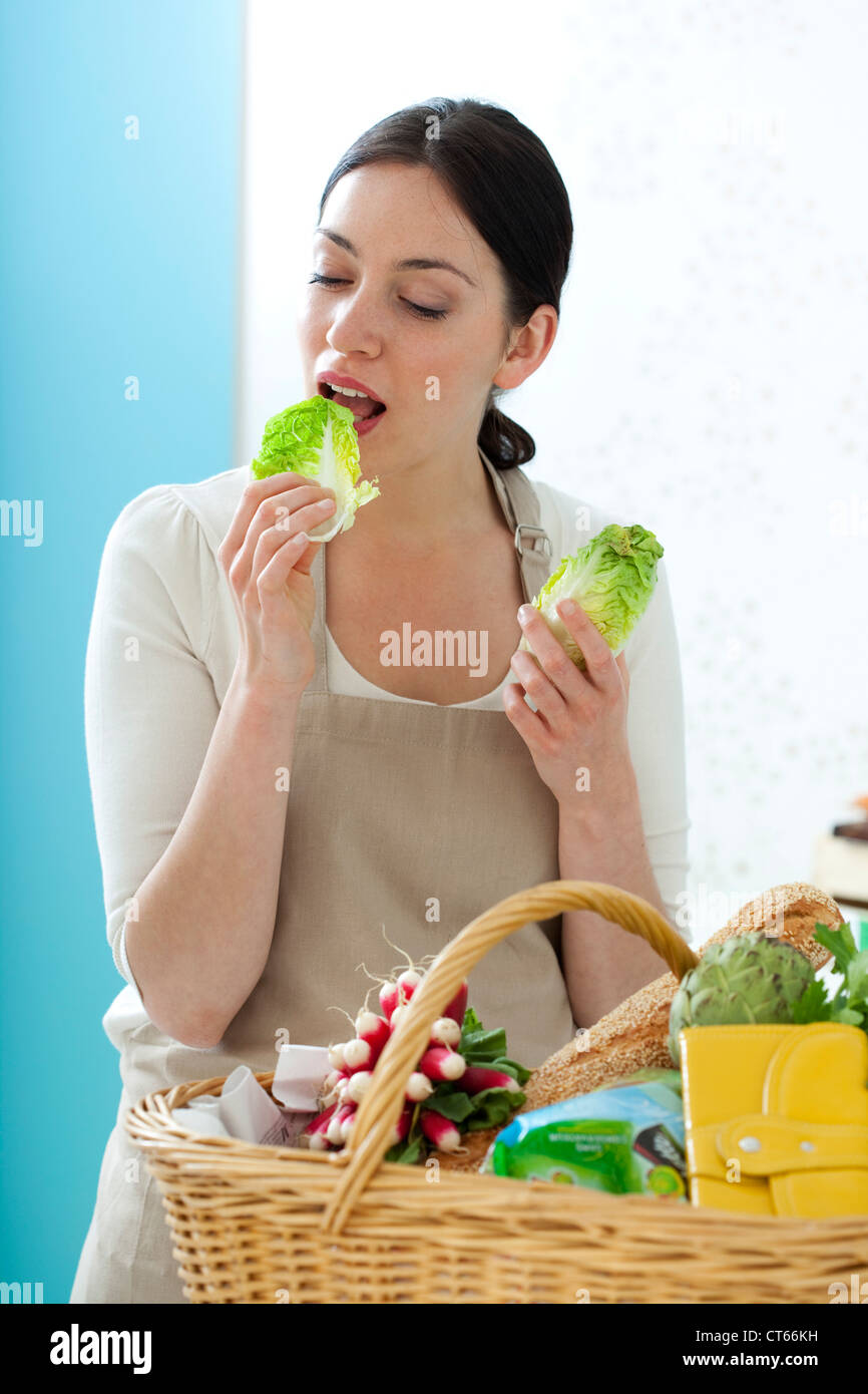 WOMAN EATING RAW VEGETABLES Stock Photo - Alamy