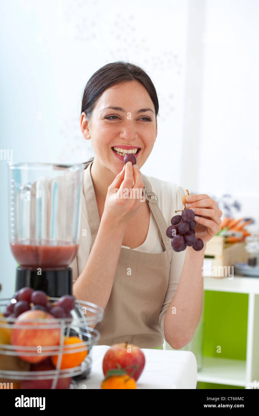 WOMAN EATING FRUIT Stock Photo - Alamy