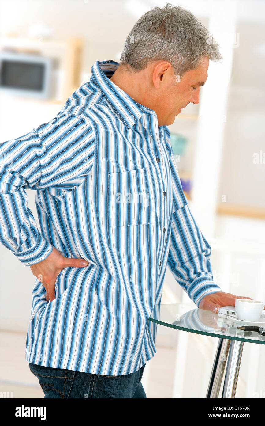 LOWER BACK PAIN IN ELDERLY PERS Stock Photo - Alamy