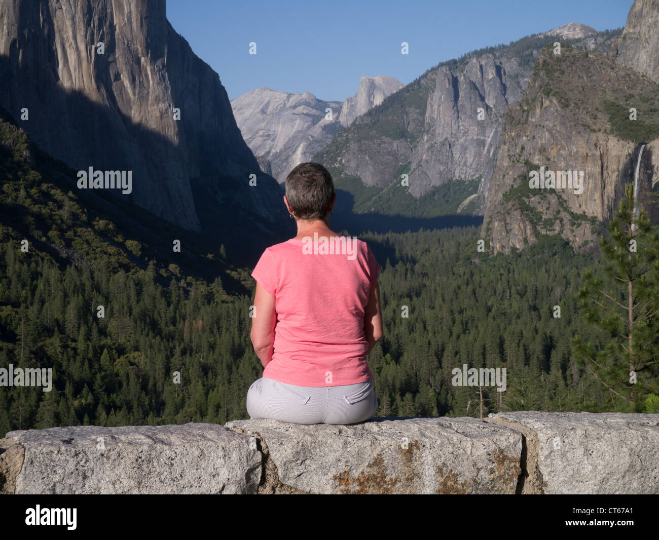 Female figure at Tunnel View viewpoint in Yosemite National Park ...