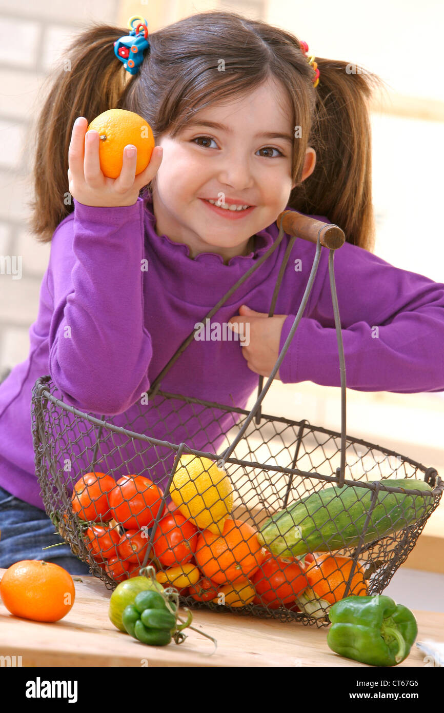 CHILD EATING FRUIT Stock Photo - Alamy