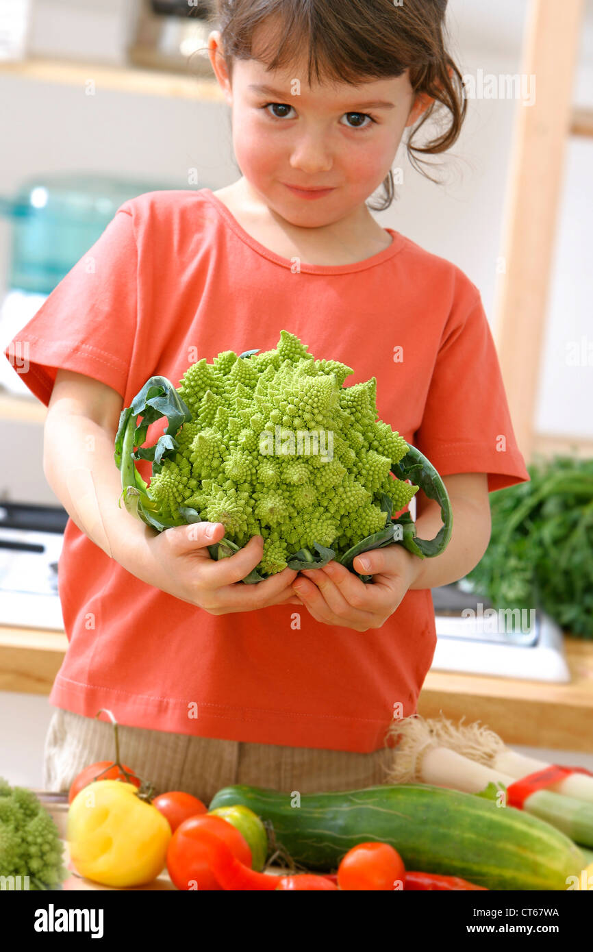 CHILD EATING VEGETABLE Stock Photo - Alamy